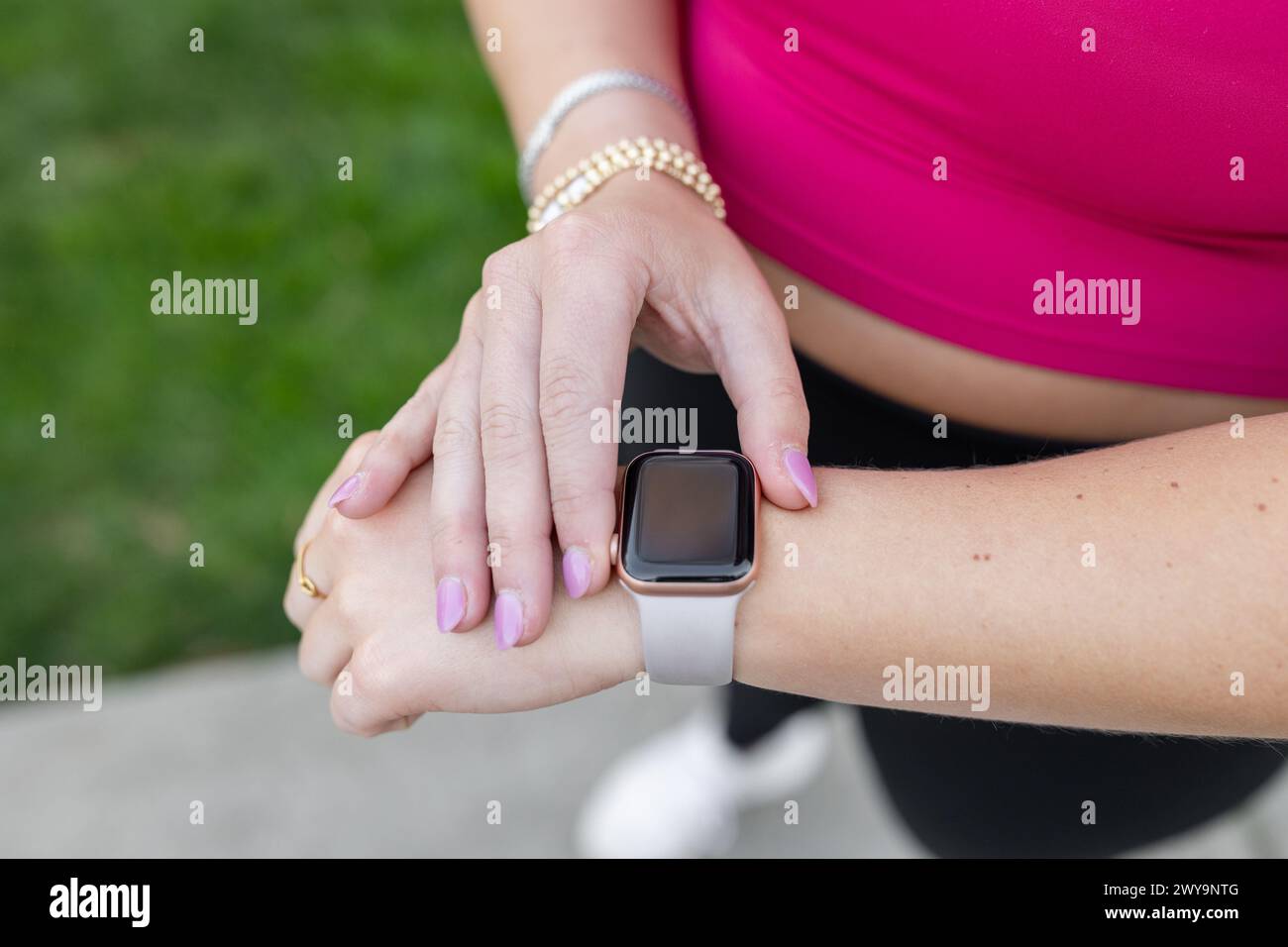Woman checking fitness health tracking hi-res stock photography and images - Alamy