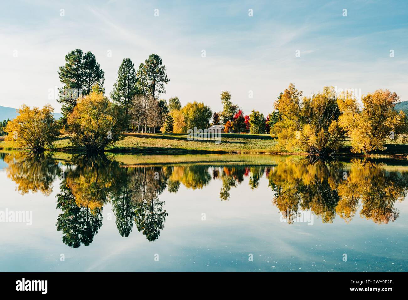 Sunny fall day with colorful fall foliage at Frenchtown Pond, Montana ...