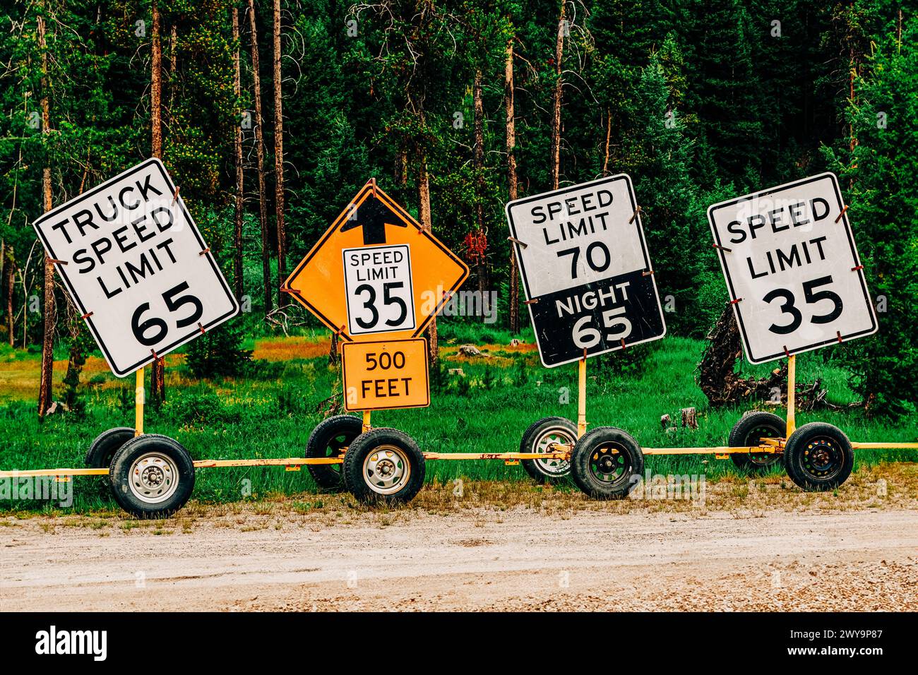 Several road construction signs lined up in a row Stock Photo - Alamy