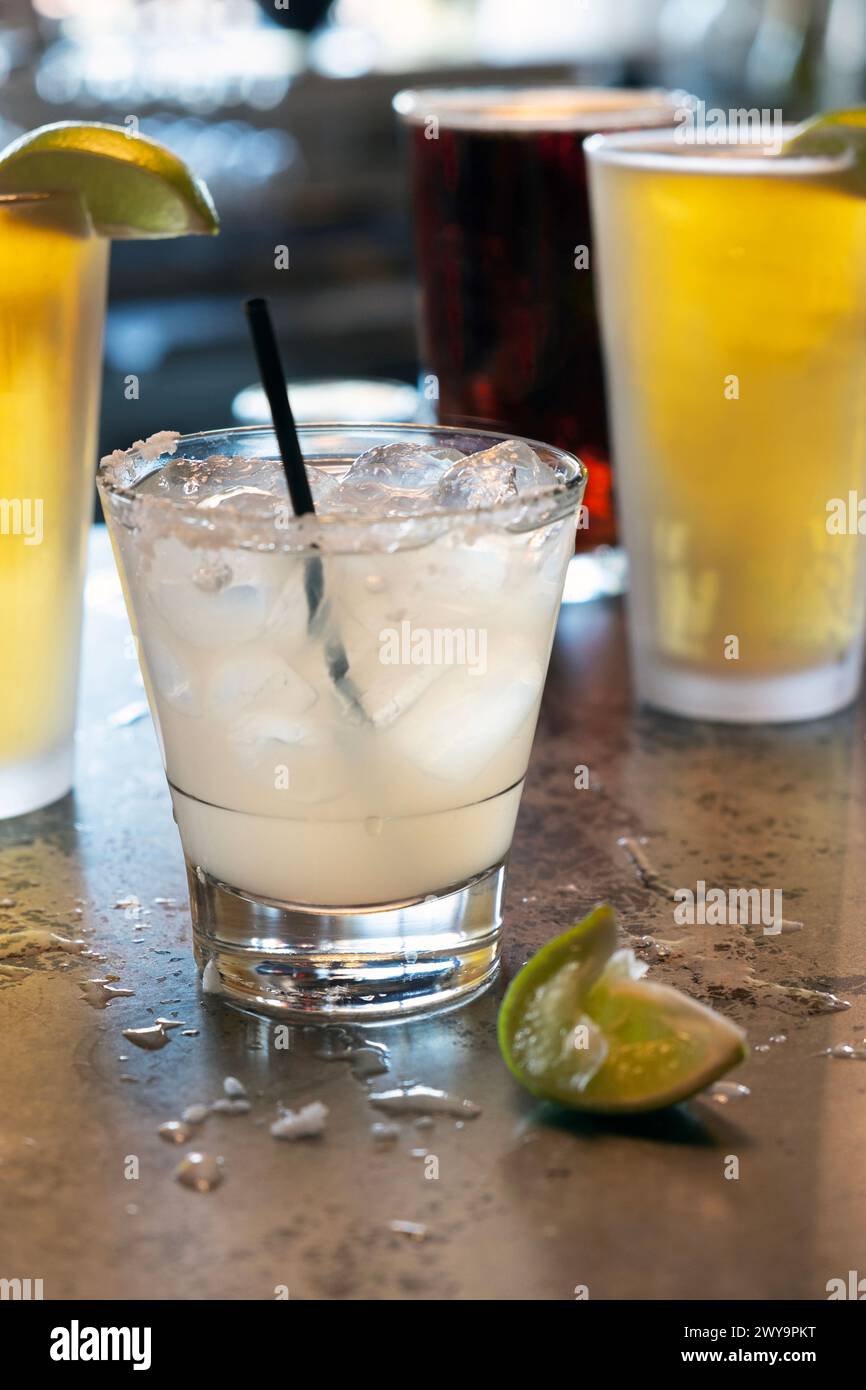 Mexican style cocktail and glasses of beer on bar top vertical Stock ...