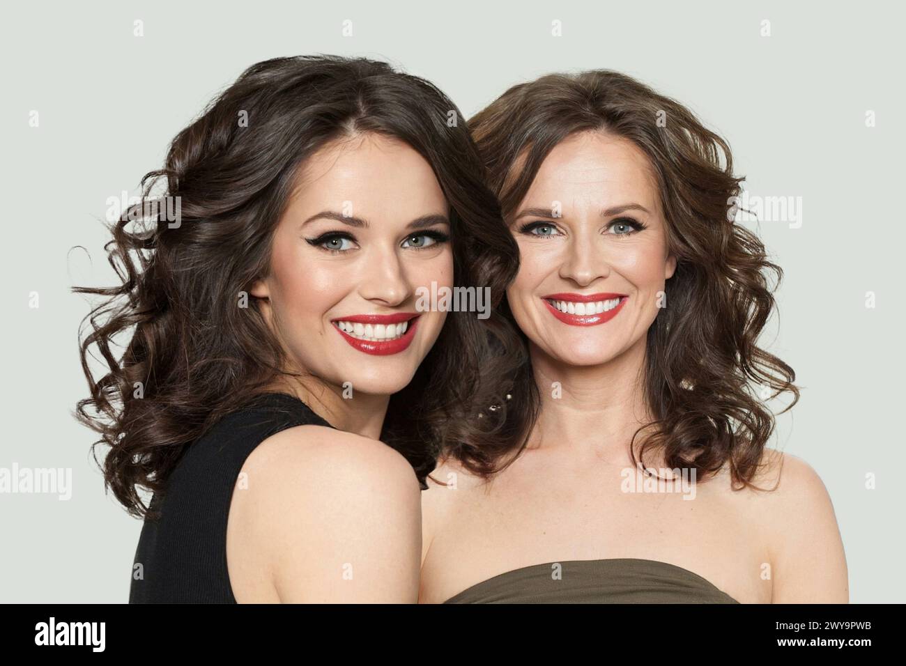 Two female models smiling. Aging, plastic surgery and retouching before ...