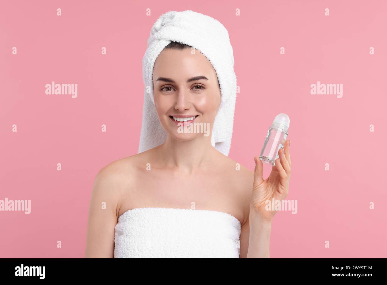 Beautiful woman with deodorant on pink background Stock Photo - Alamy