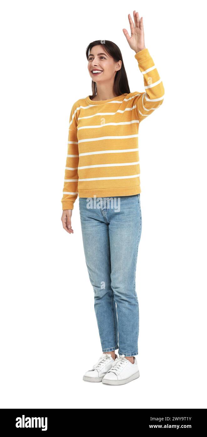Happy woman greeting someone on white background Stock Photo - Alamy