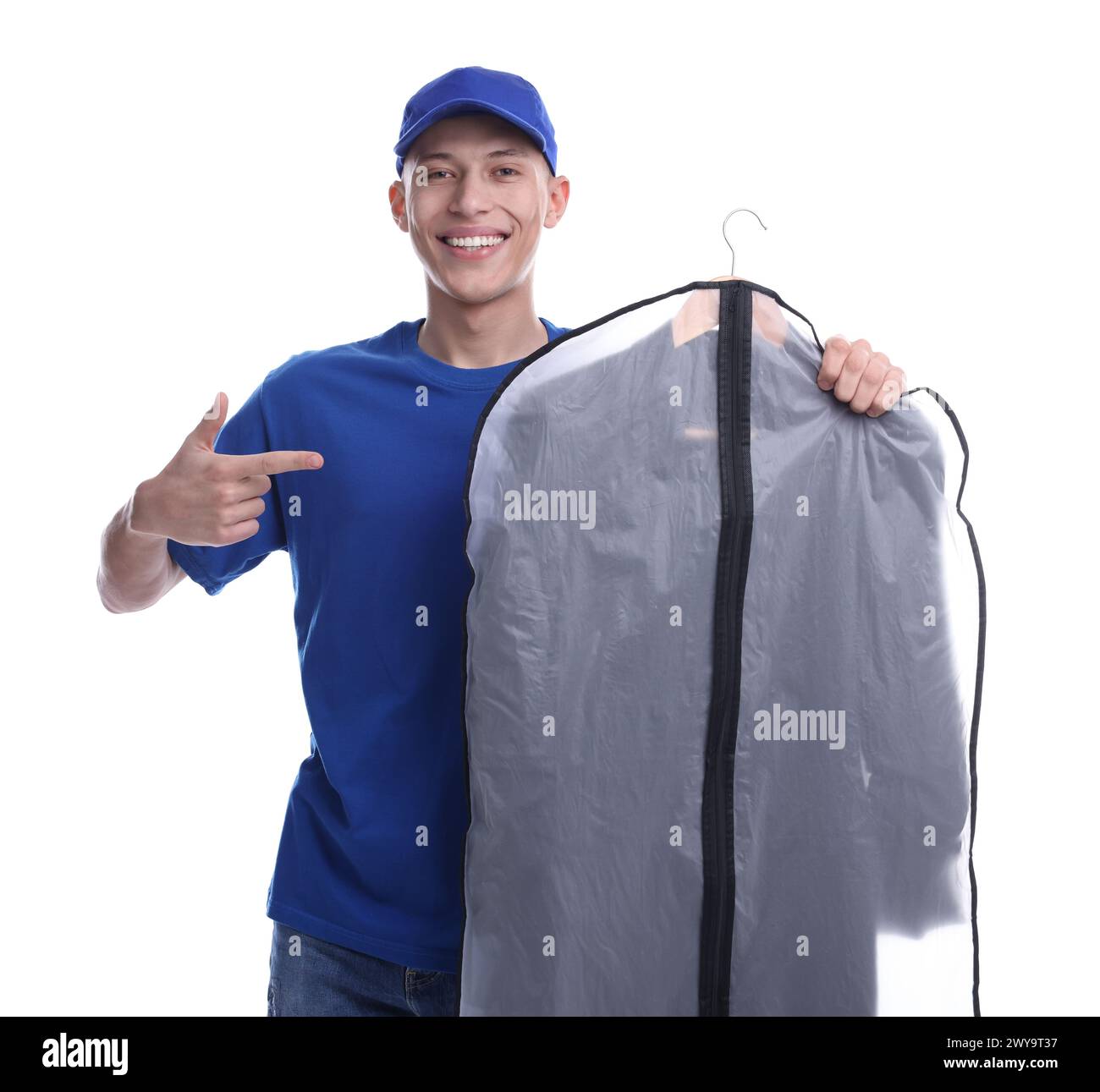 Dry-cleaning delivery. Happy courier holding garment cover with clothes ...