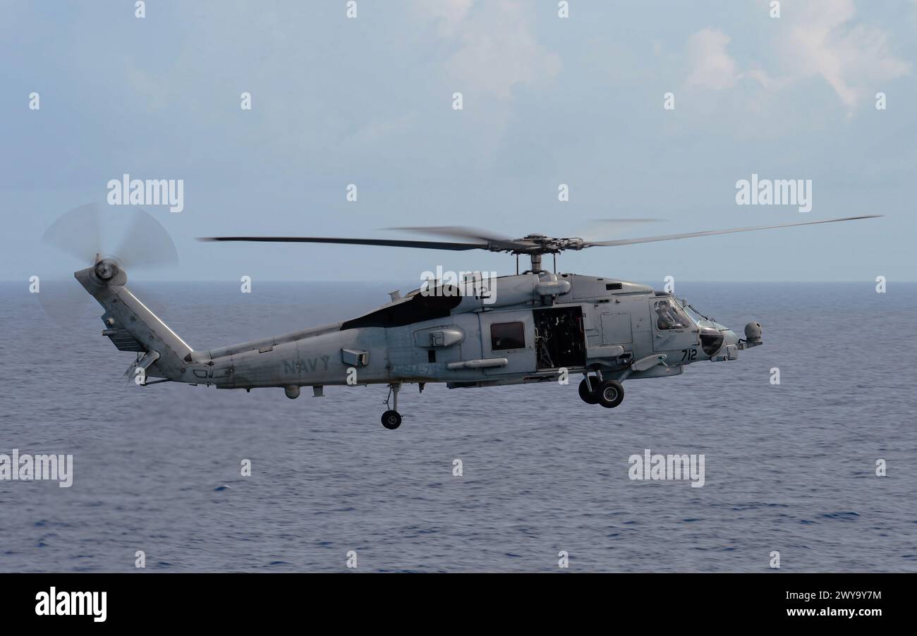 SOUTH CHINA SEA (March 27, 2024) An MH-60R Sea Hawk, assigned to the ...