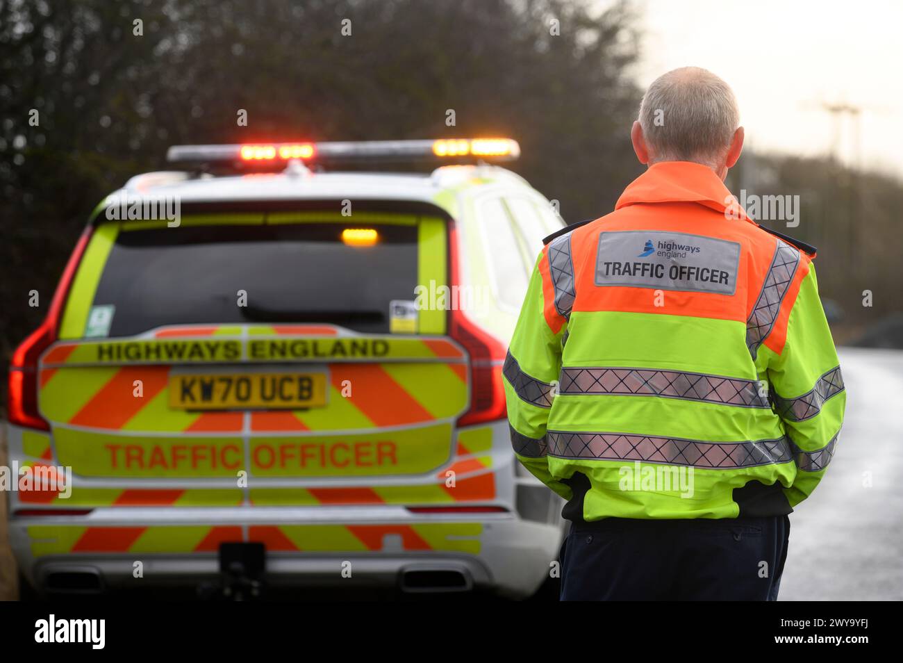 Highways England traffic officer and vehicle on patrol in England Stock ...