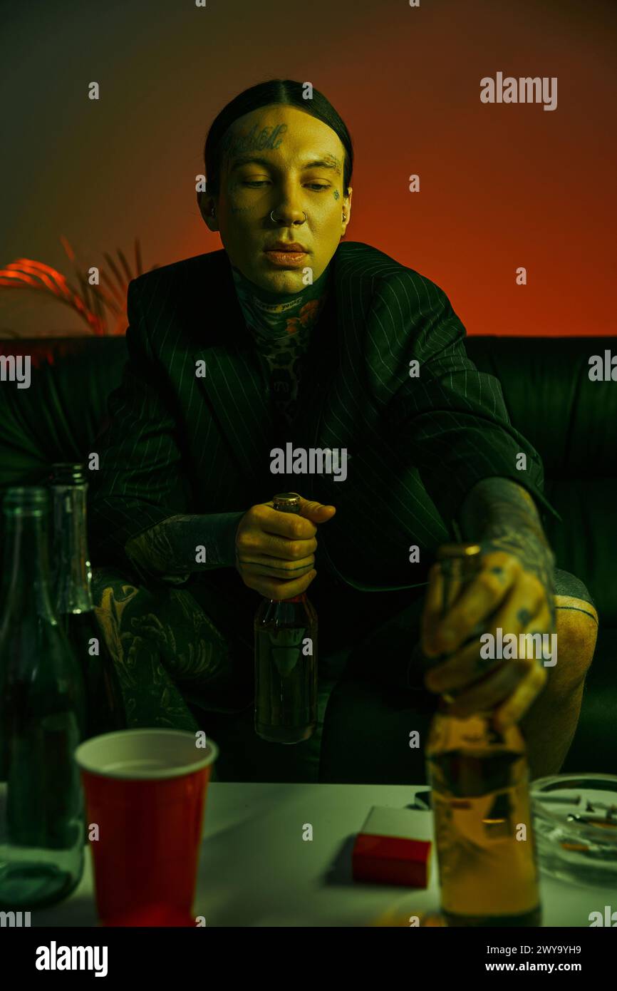 Young man seated table hi-res stock photography and images - Alamy