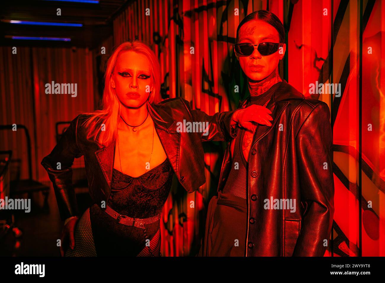 Two women standing side by side at a rave-party Stock Photo - Alamy