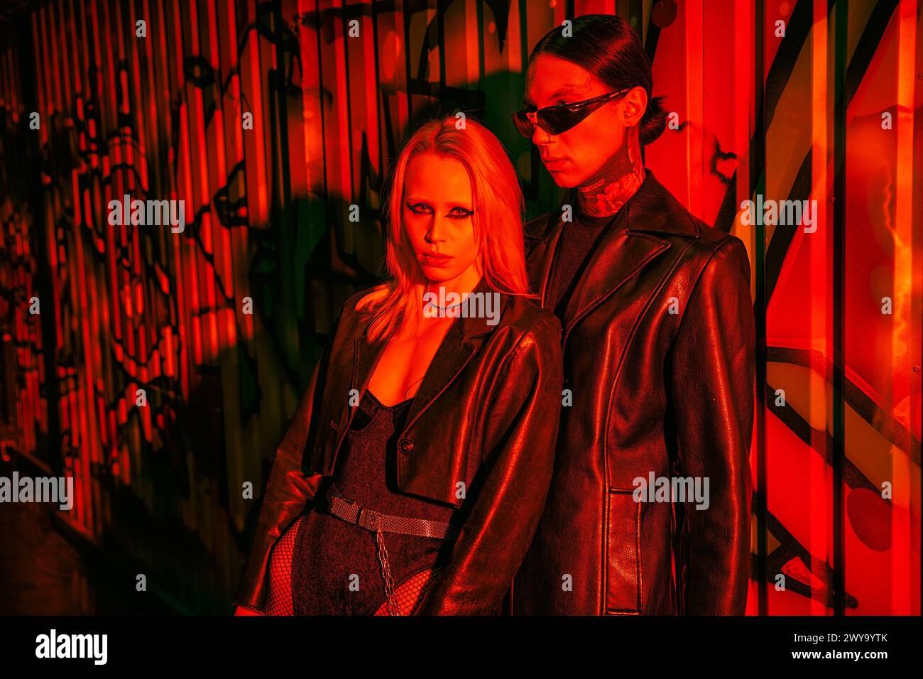 Couple of women standing side by side at a rave-party event Stock Photo ...