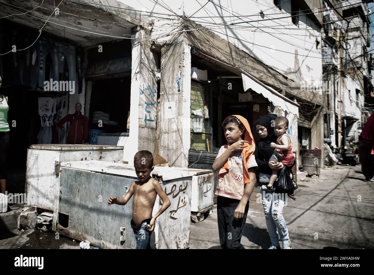 Photograph of the dynamic street life of Sabra-Shatila Refugee Camp in ...