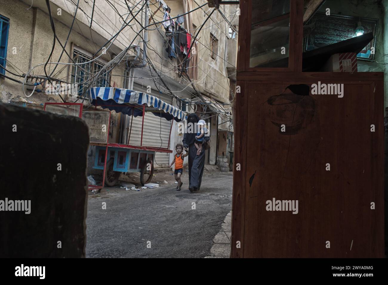 Photograph of the dynamic street life of Sabra-Shatila Refugee Camp in ...