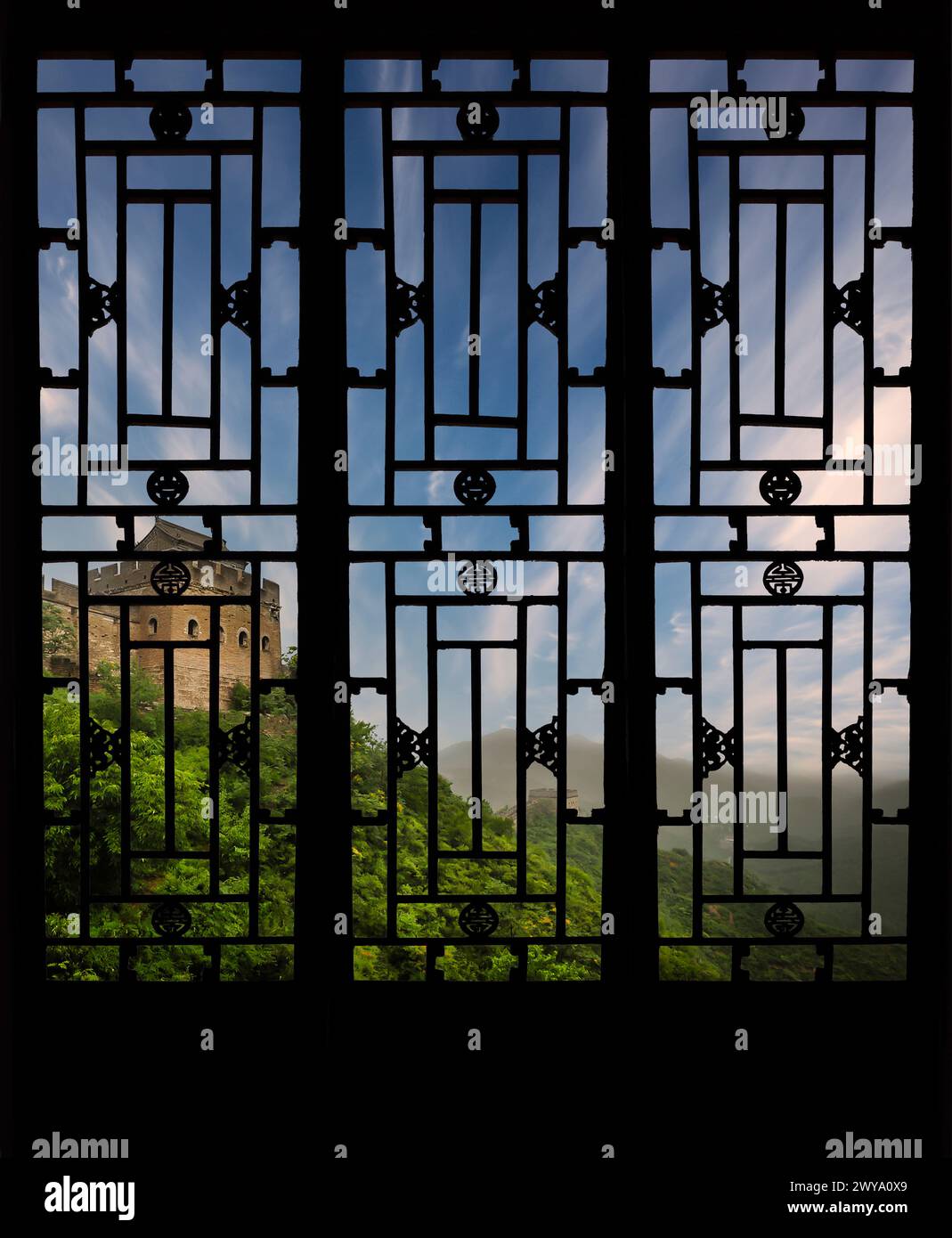 View through a fretwork screen panel of the Great Wall fort, China ...