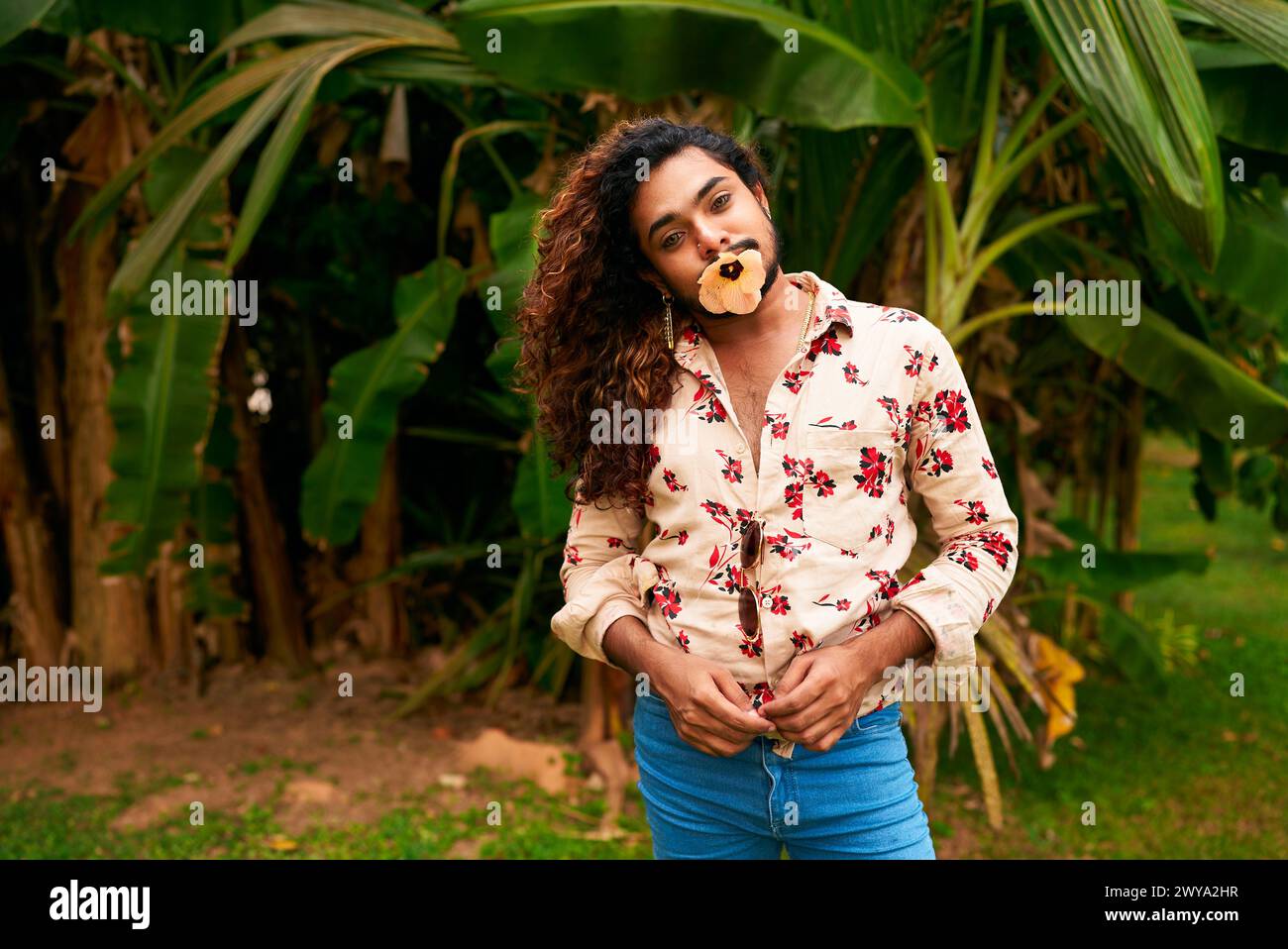 Sri Lankan man with flower in hair portrays femininity, leaning on ...