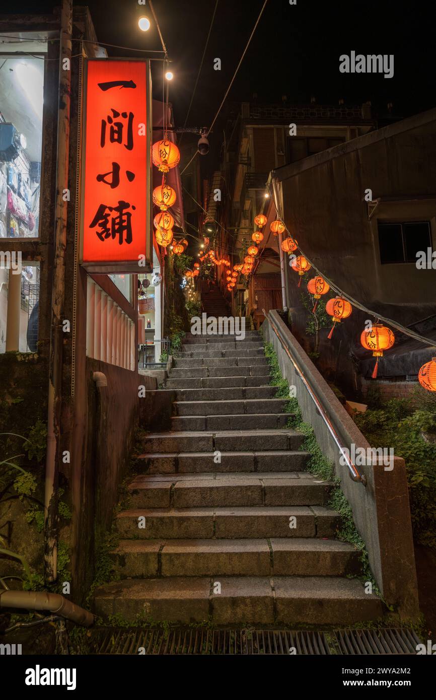 An alley exudes charm with a series of red lanterns guiding the way up ...