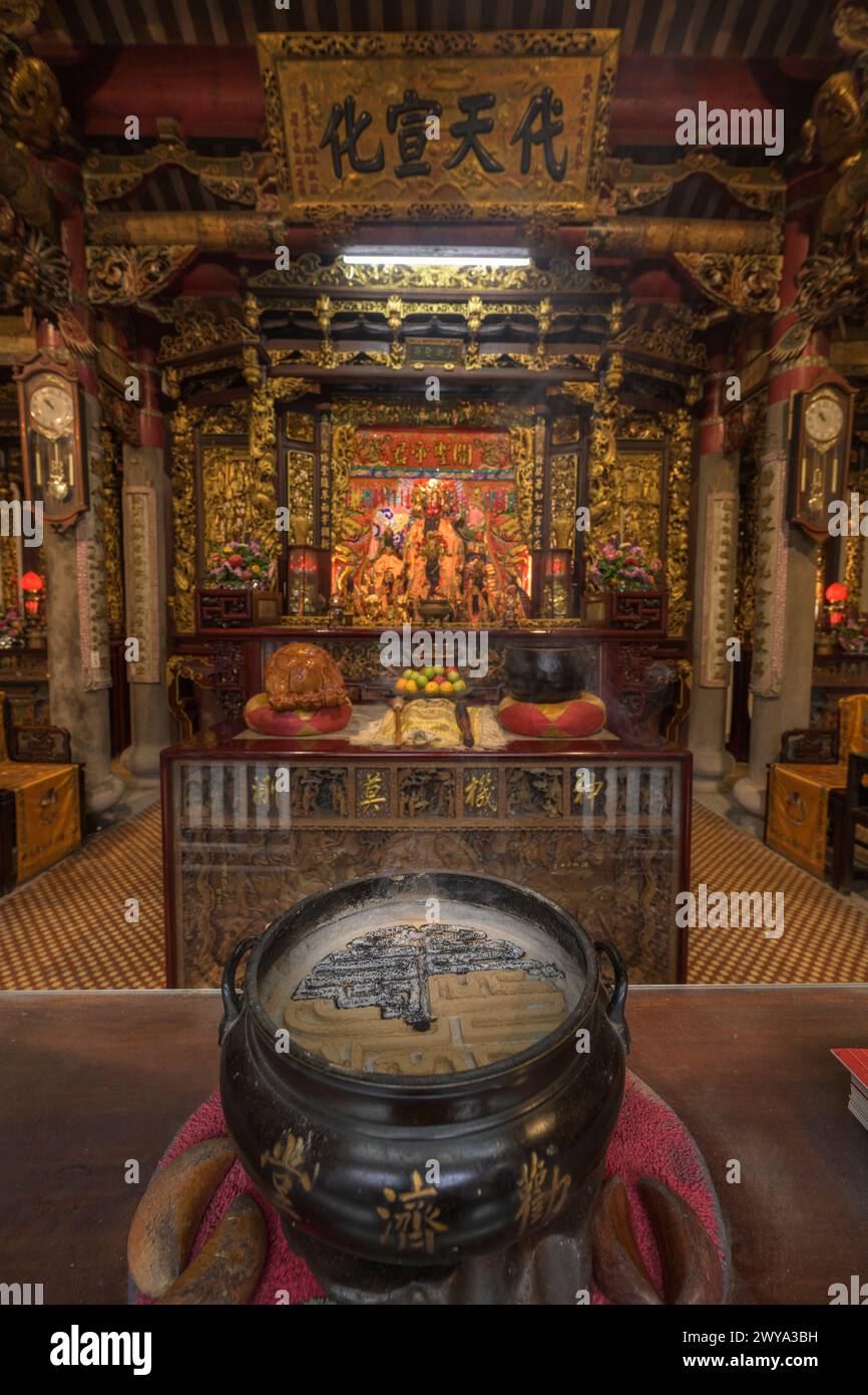 The ornate altar of Chuen Ji Hall temple with religious deities and ...