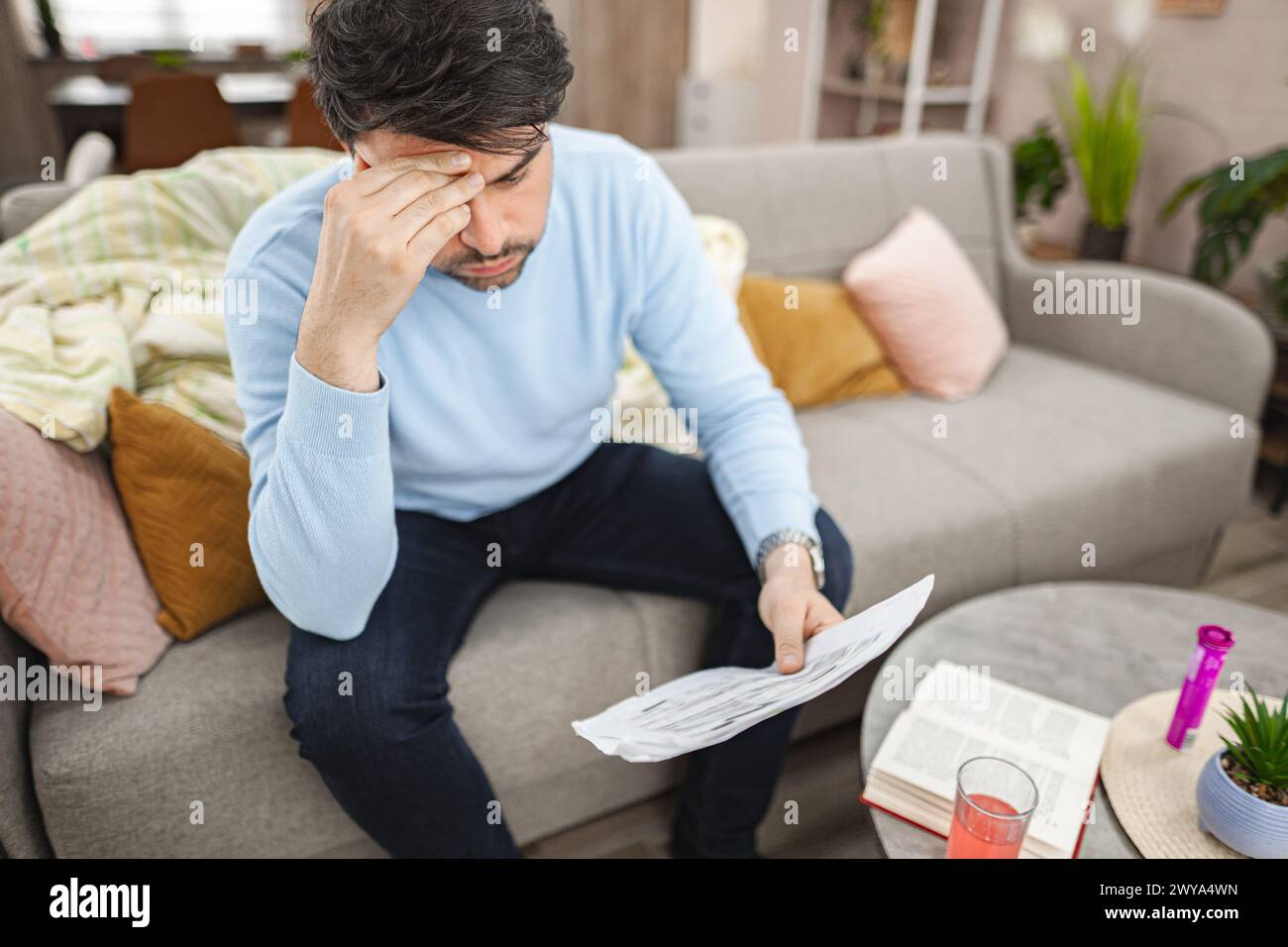 Man checking bills taxes home hi-res stock photography and images - Alamy