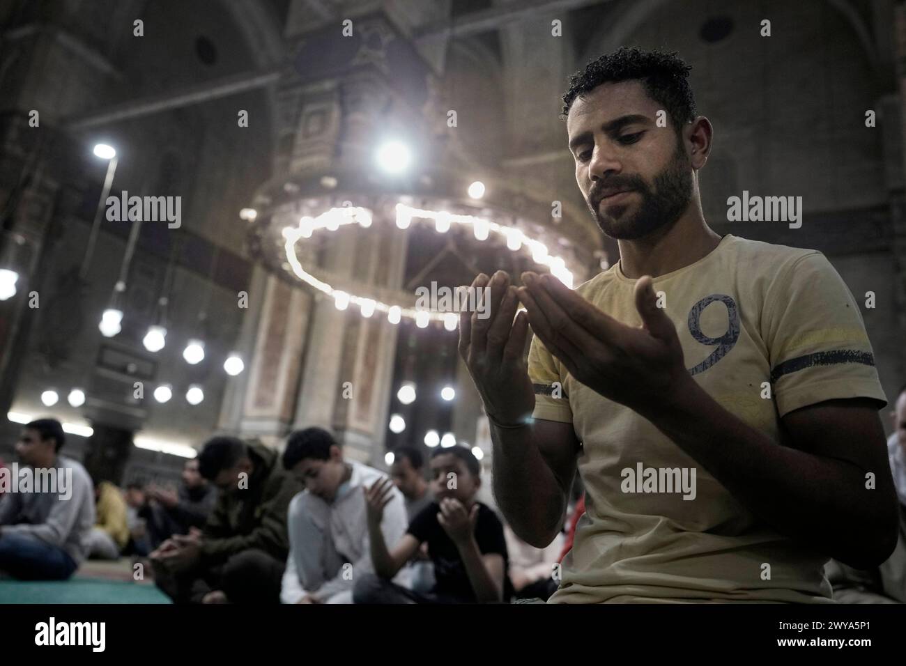 A Muslim worshippers pray during the Muslim holy fasting month of ...