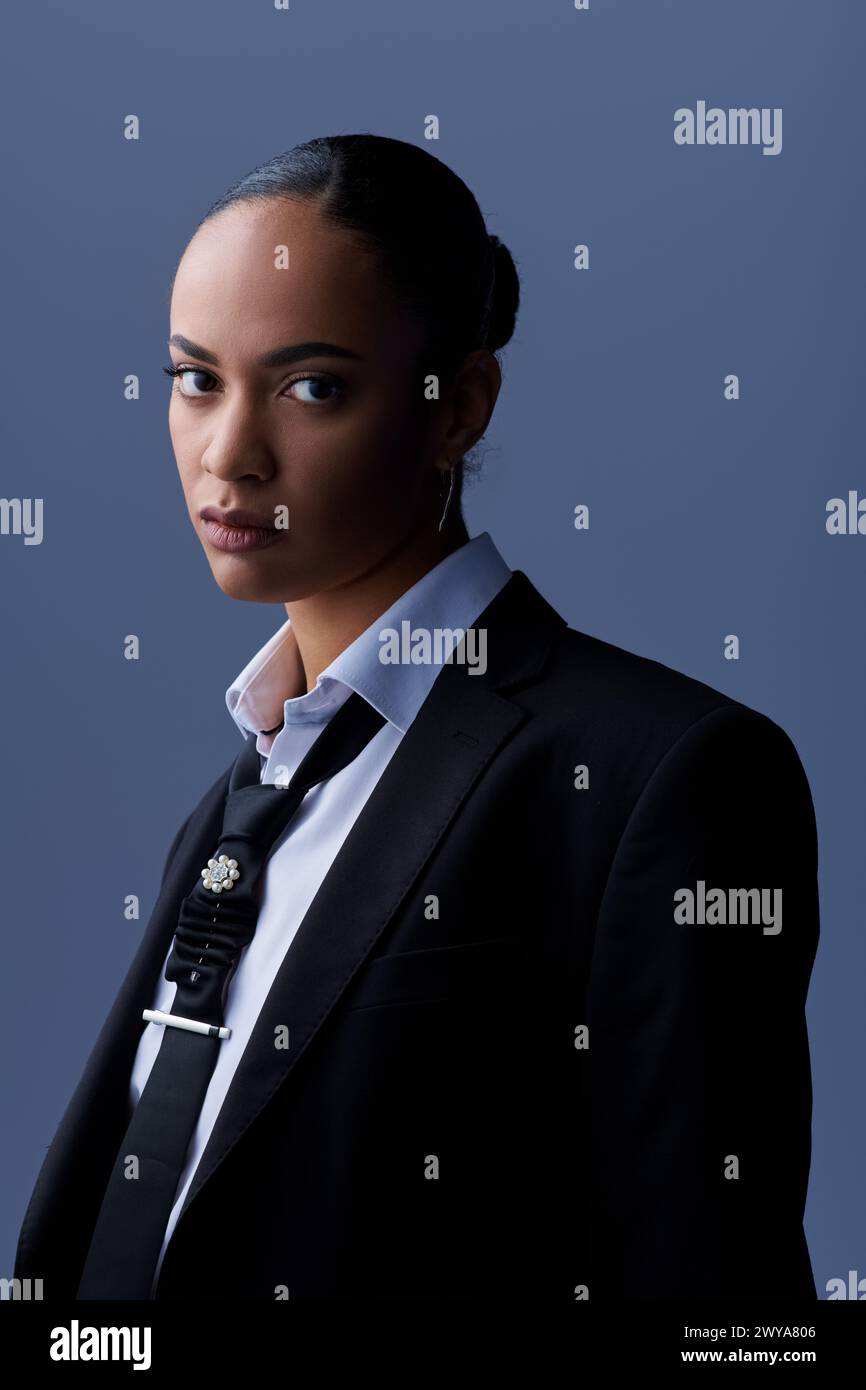 A stylish young African American woman confidently posing in a suit and ...