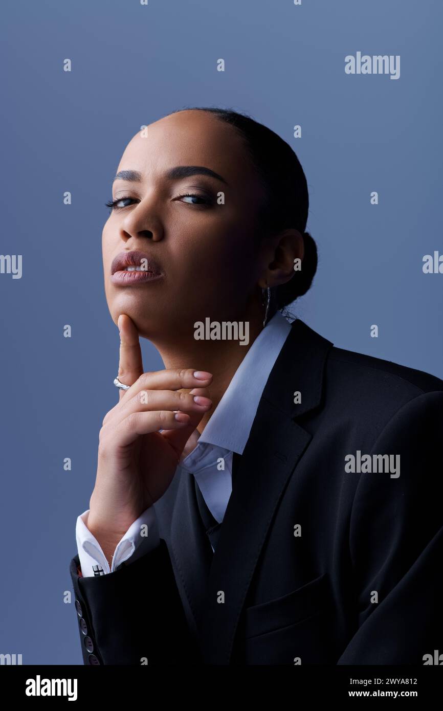 A young African American female model in a business suit posing for a ...