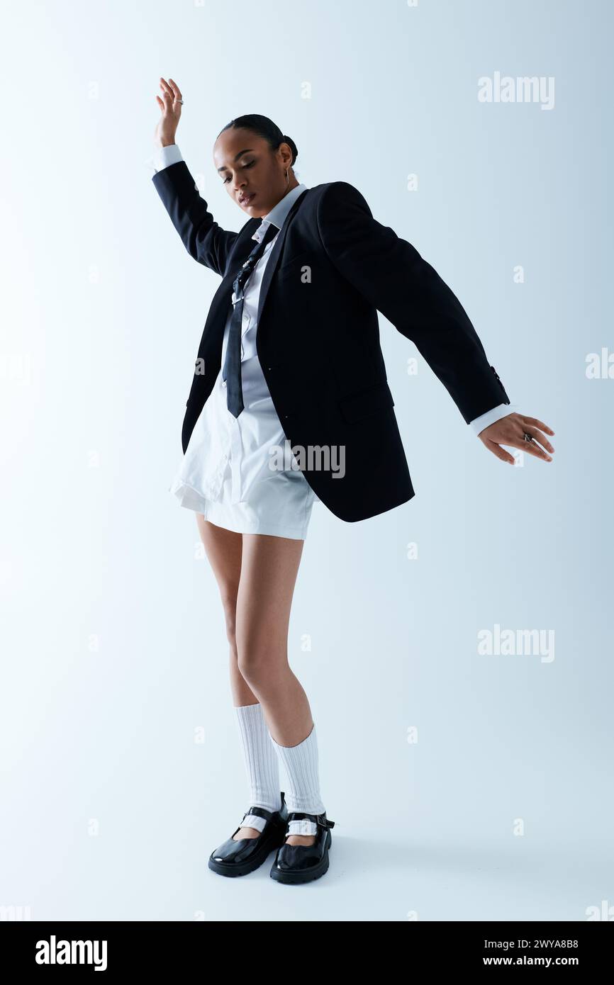 A young African American woman in her 20s confidently struts in a ...