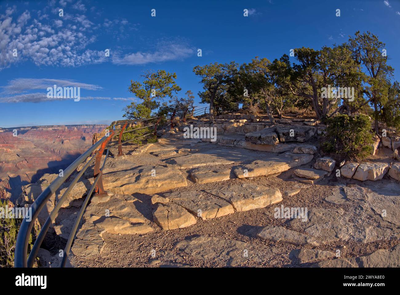 The safety railed stone cliff of the Mohave Point Overlook, Grand ...