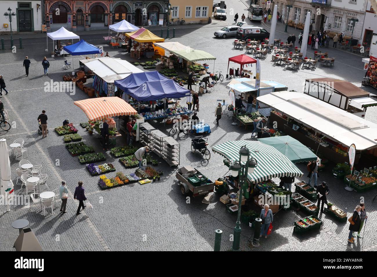 Weimar, Germany. 05th Apr, 2024. Traders stand on the town's market ...