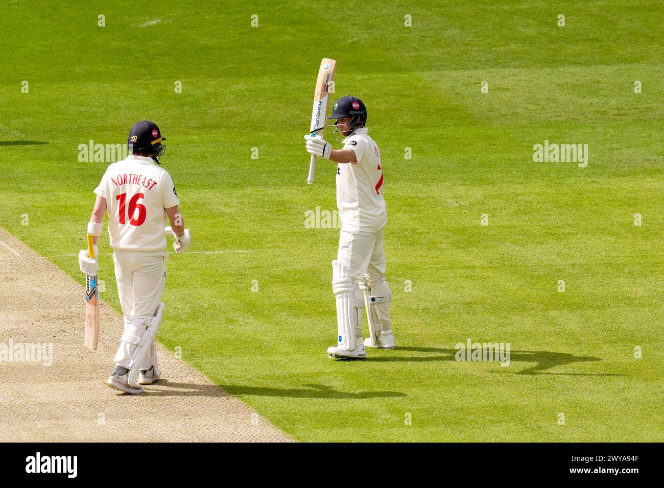 Glamorgan's Billy Root (right) celebrates reaching his 50 during day ...