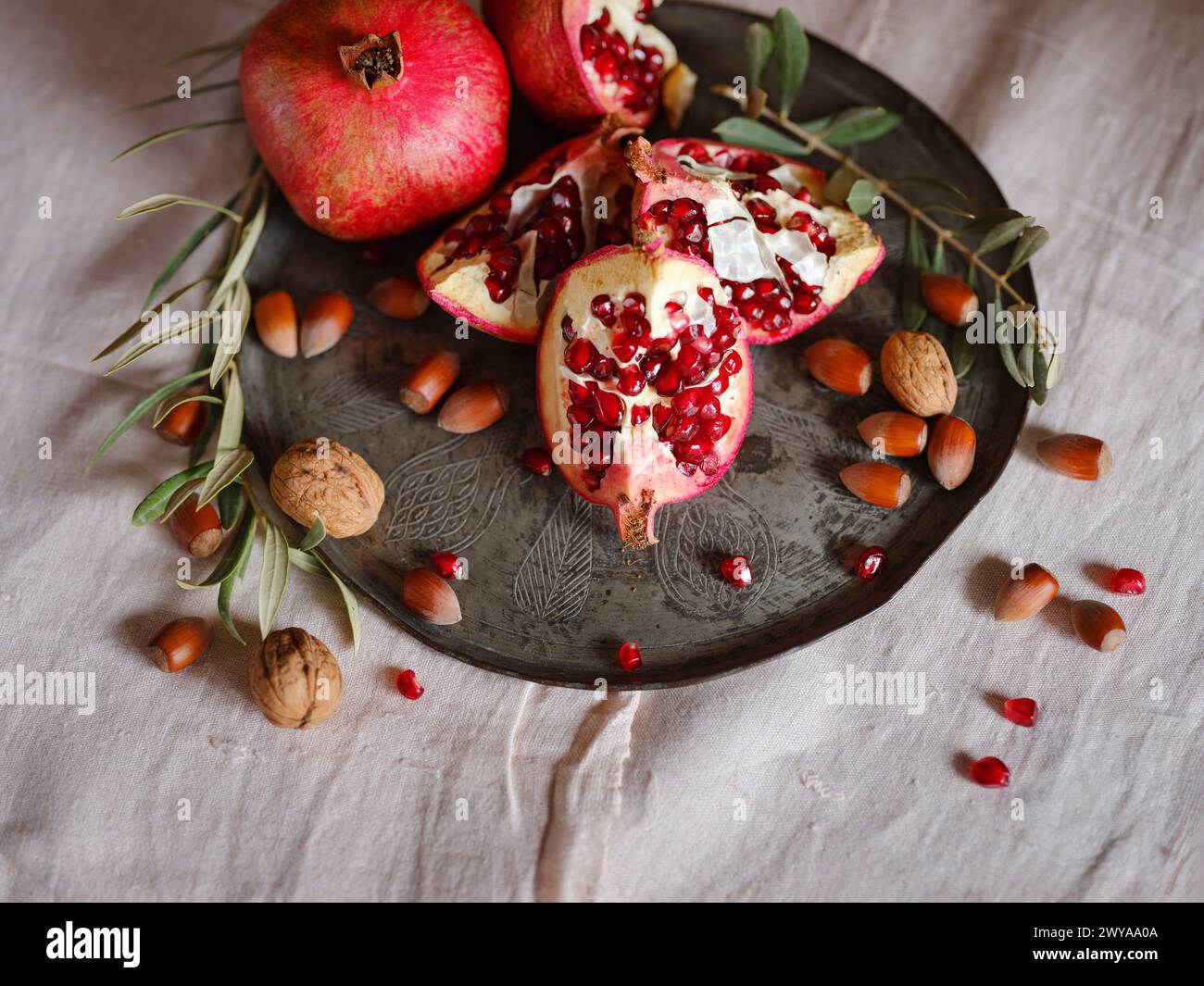 Image of Still Life with Turkish Pomegranate and olive branch on old ...