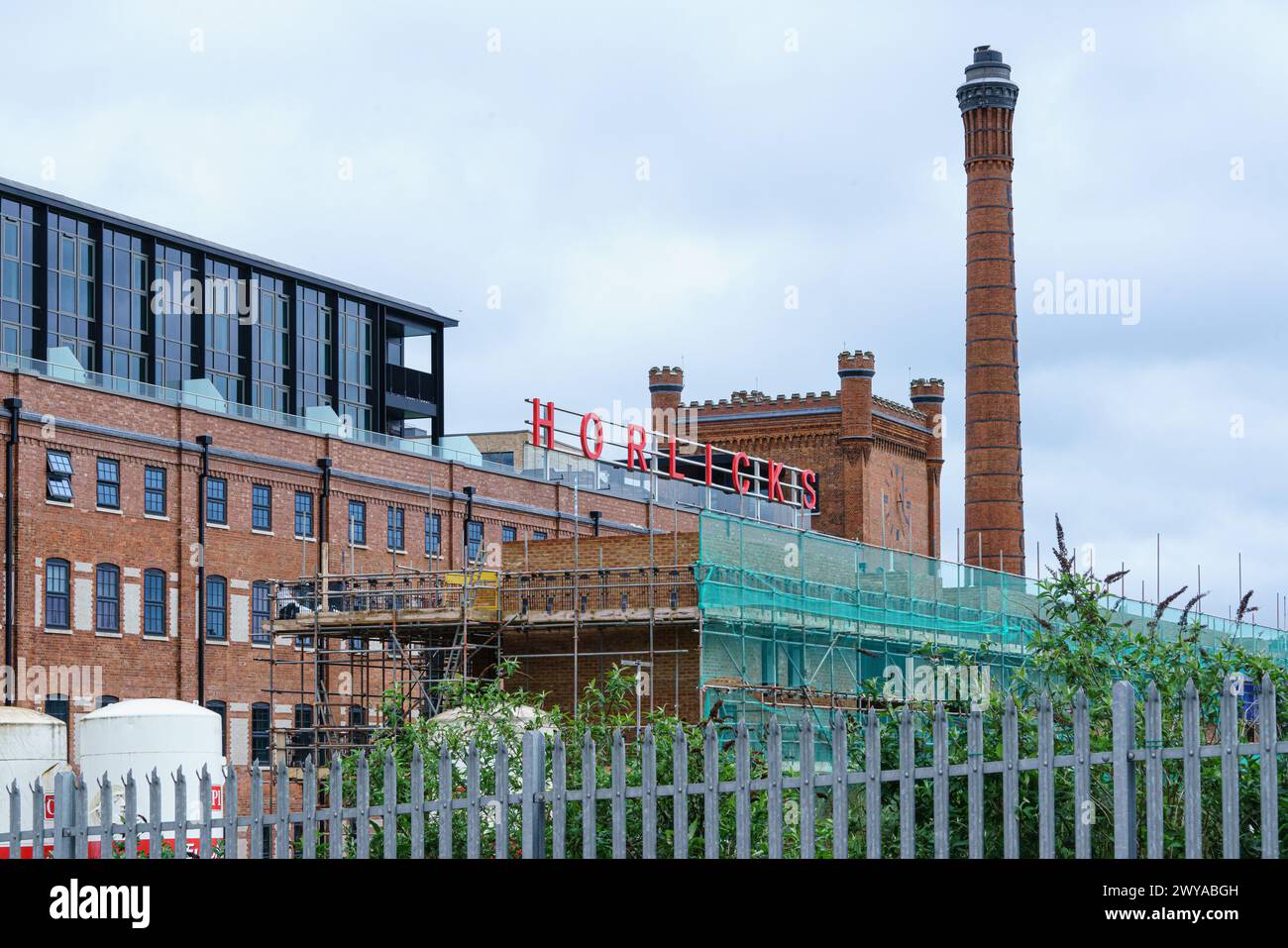 Work continues on the main building, clock tower, and new build houses ...