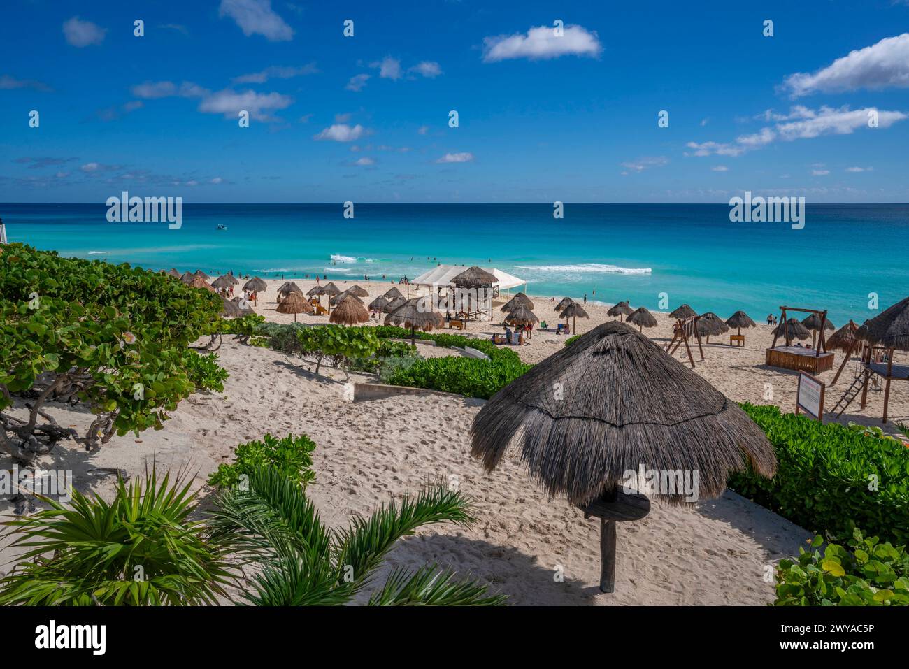 View of long white sandy beach at Playa Delfines, Hotel Zone, Cancun ...