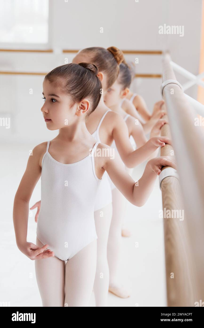 Group portrait of of charming pretty little girls, ballerinas in ...