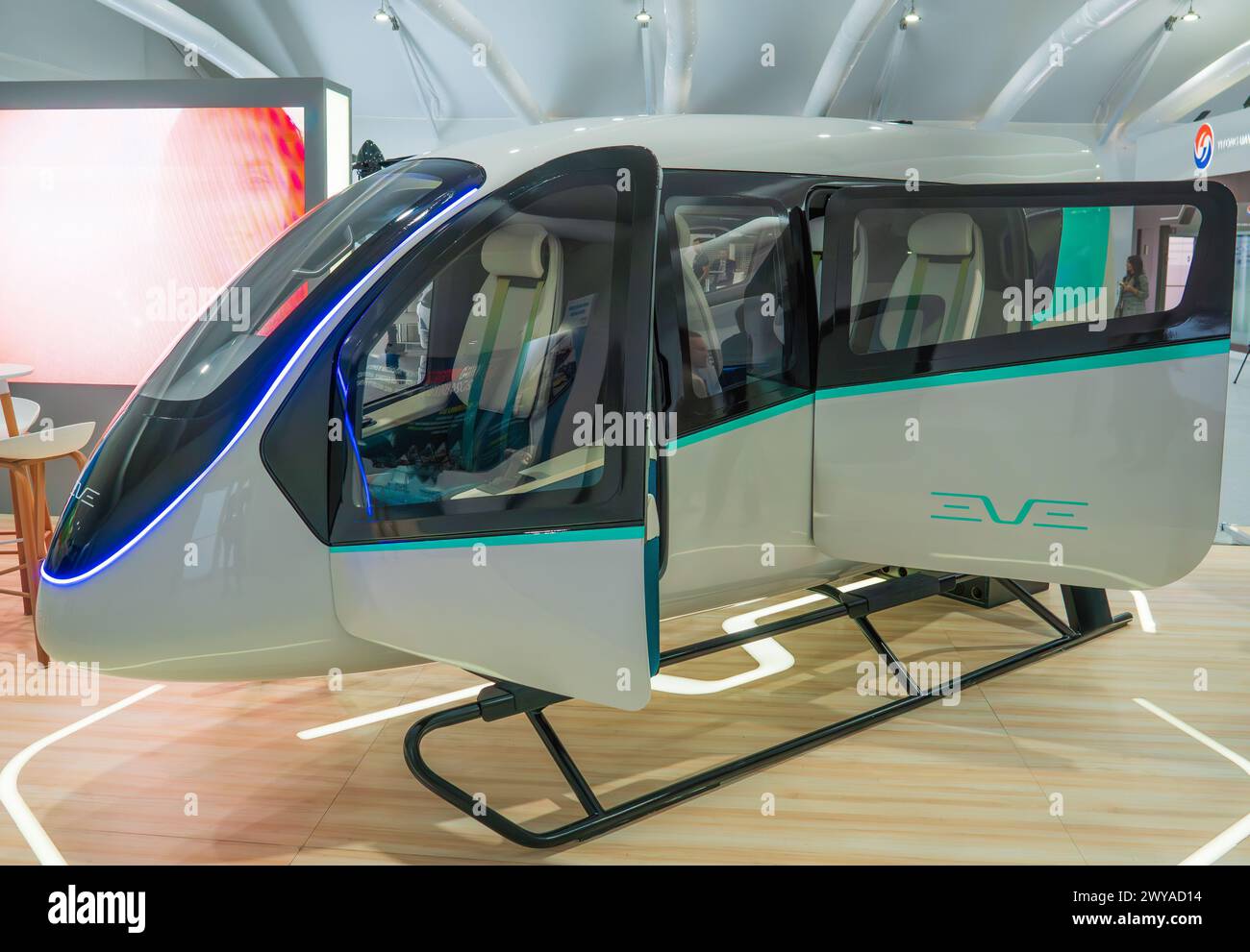 Eve Air Mobility eVTOL on display indoors at Dubai Airshow, a subsidiary of Embraer. Electric ...