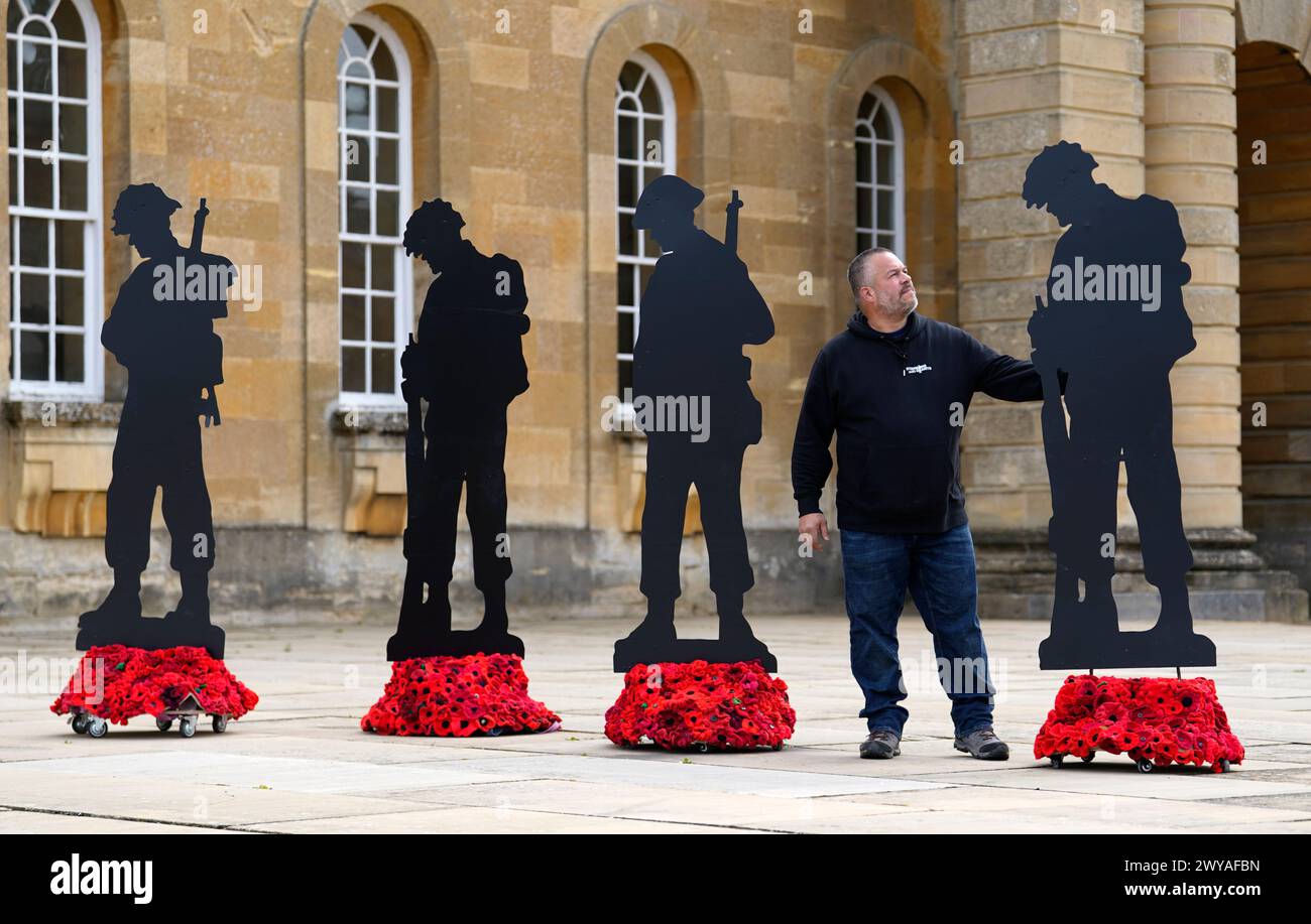 Artist Dan Barton stands beside some of the giant silhouettes from the ...