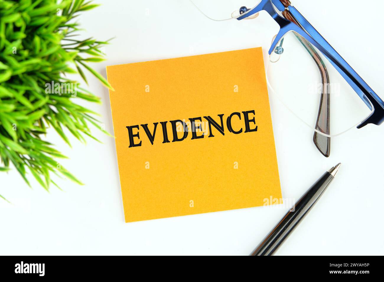 Word Evidence written on an orange sticker on a white background Stock ...