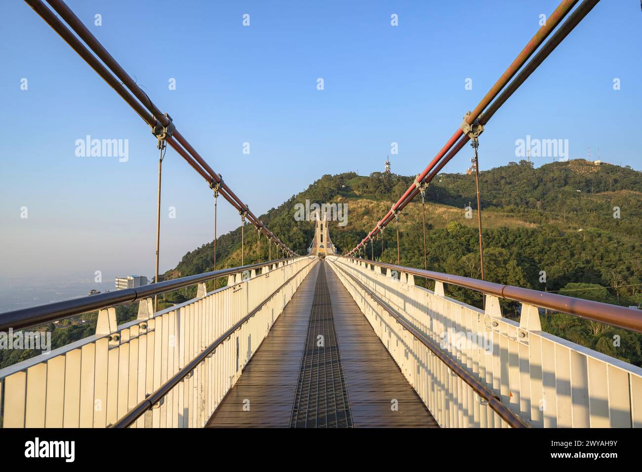 Modern Taiping suspension bridge with a distinct arch and cables ...