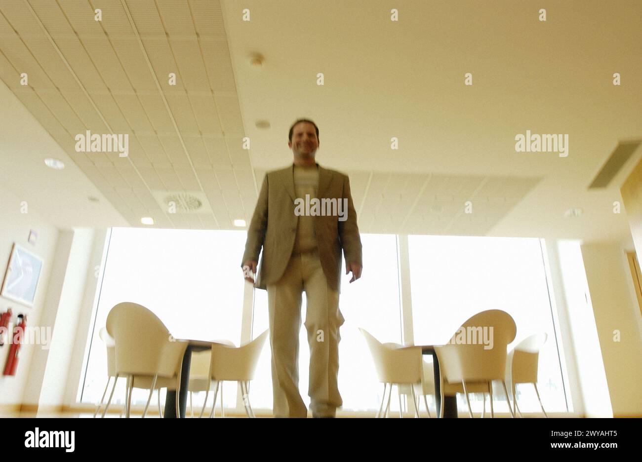 Businessman walking on chairs hi-res stock photography and images - Alamy
