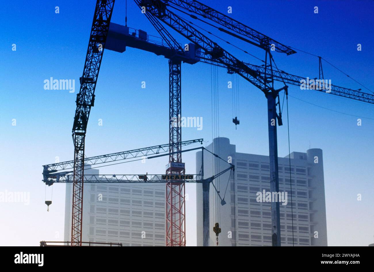 Construction cranes. Bologna. Italy Stock Photo - Alamy