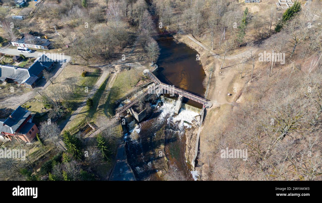 Drone photography of small dam, waterfall and bridge over it during ...