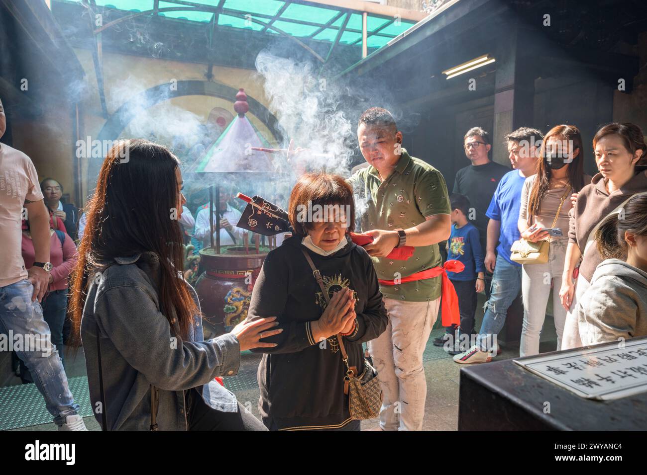 A Taoist shaman practicing a religious ceremony for one of his ...