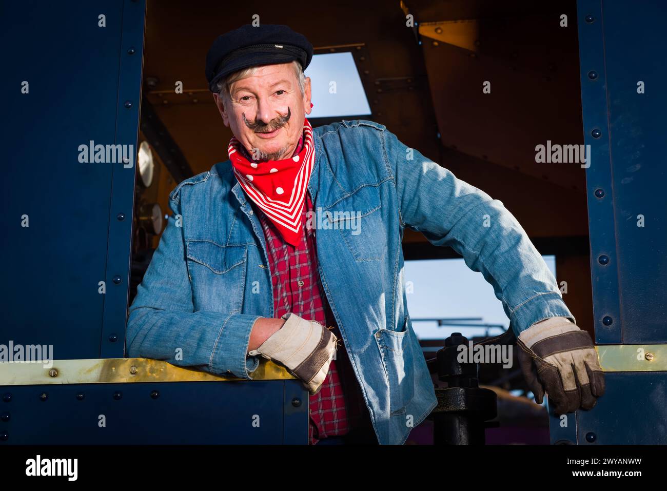 Reenactment scenes of a vintage worker or machinist in an authentic ...