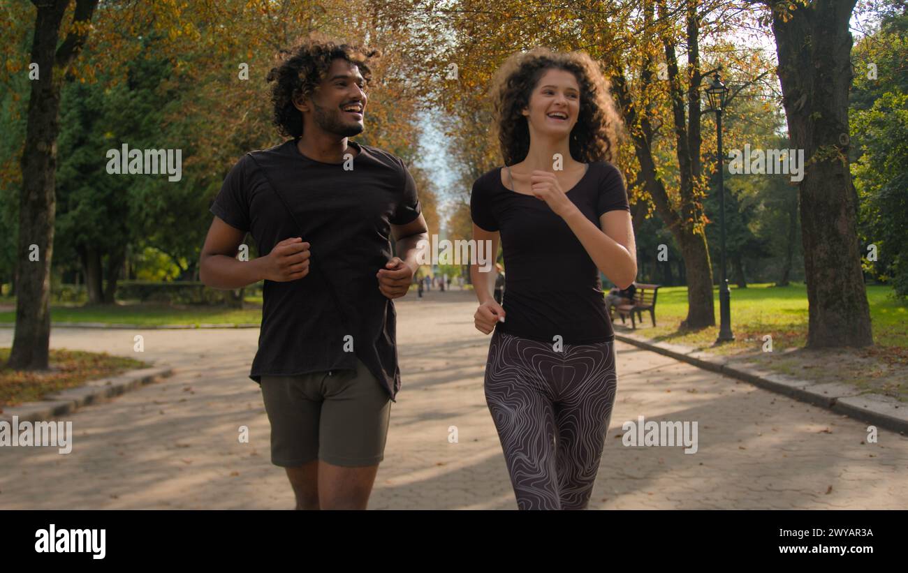 Happy multiracial runners healthy sportsman and sportswoman running ...