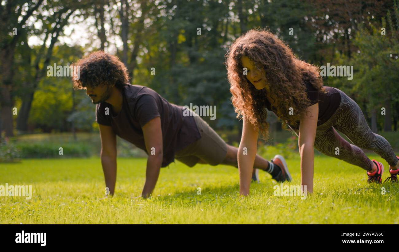 Healthy practice sport strong multiracial couple Arabian Indian man ...