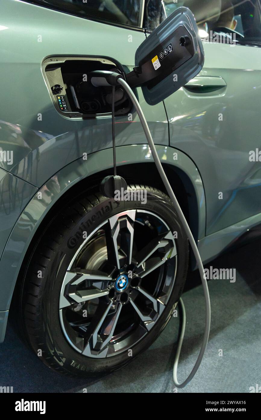 Kuala Lumpur, Malaysia - May 5,2023 : Ev charging for BMW The iX1 displaying in the motor show ...