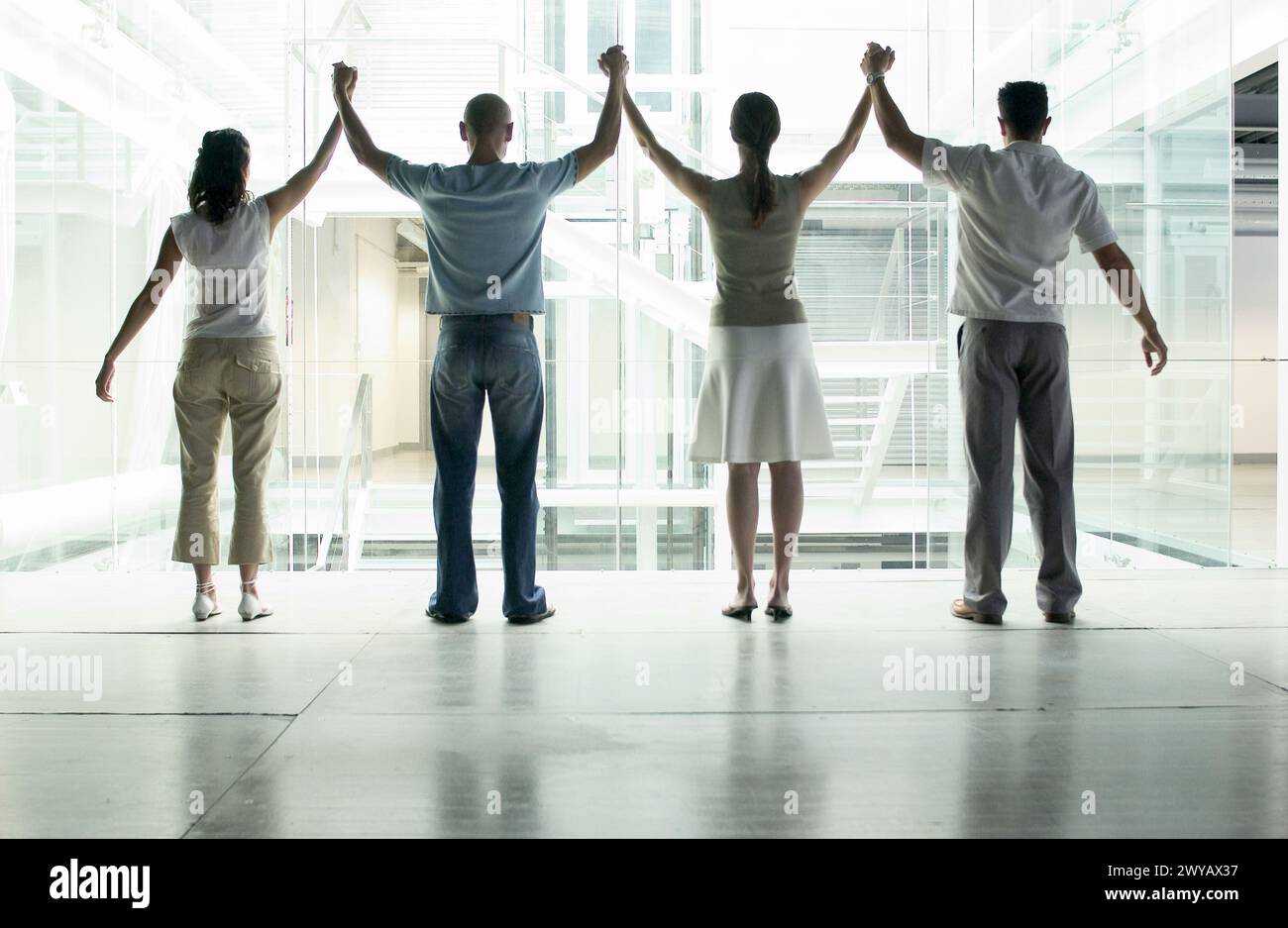 Business professionals raising hands hi-res stock photography and ...