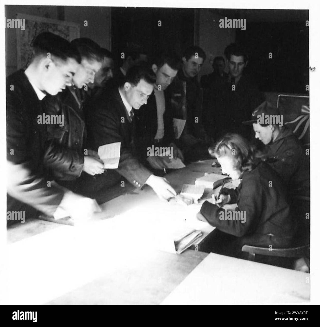 Displaced persons register at a centre and present identity cards on ...