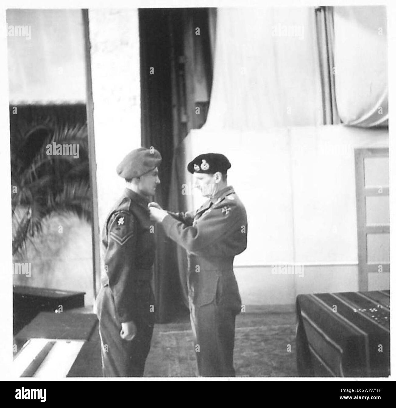 43 DIV. INVESTITURE - Original wartime caption: Bdr. S.A. Rooney, 179 ...