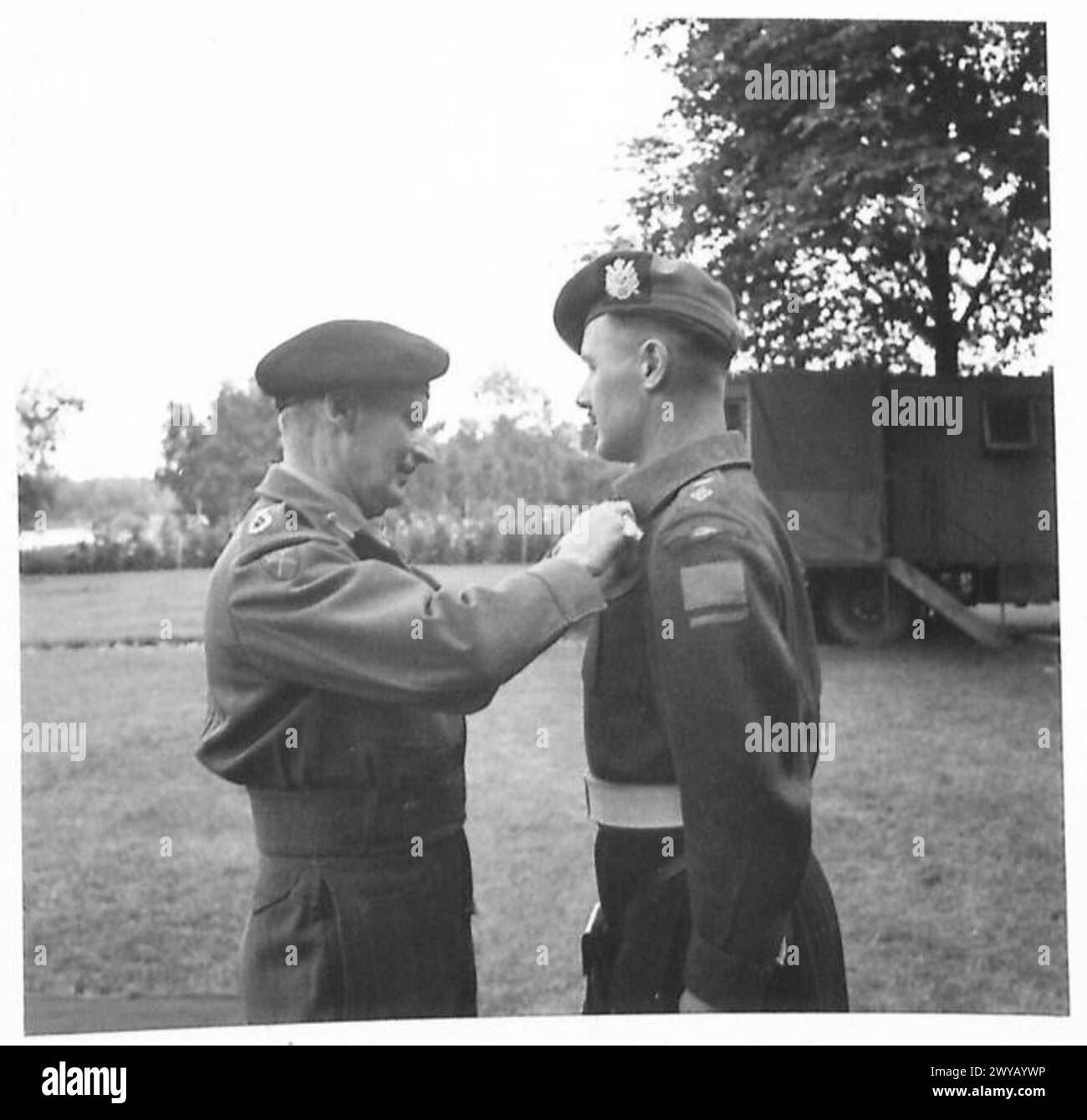 Lieutenant Colonel L.S. Henderson of 4/C Section R receives the ...