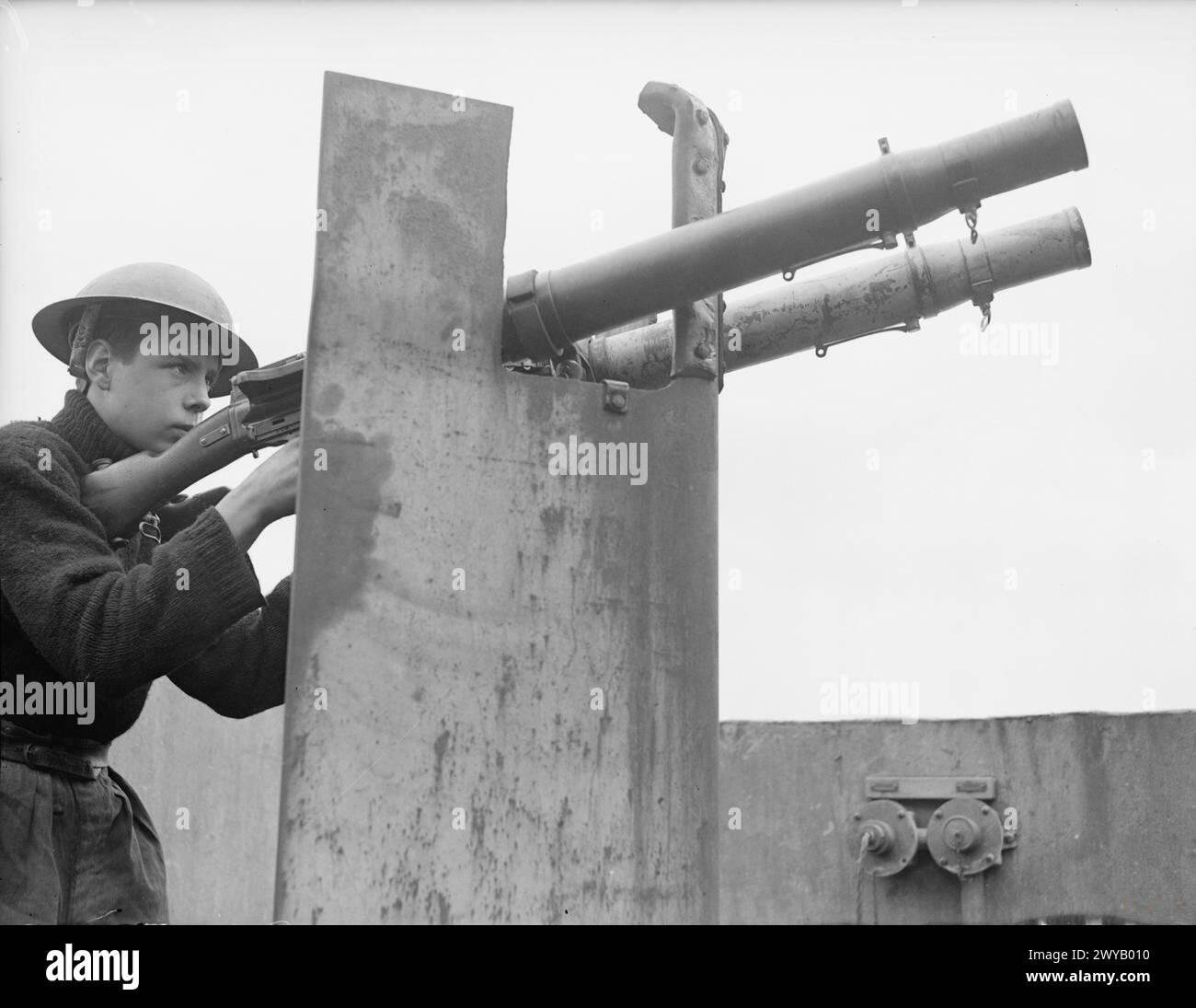 George Thomas, aged 16, operates a twin-mounted Lewis gun aboard the ...