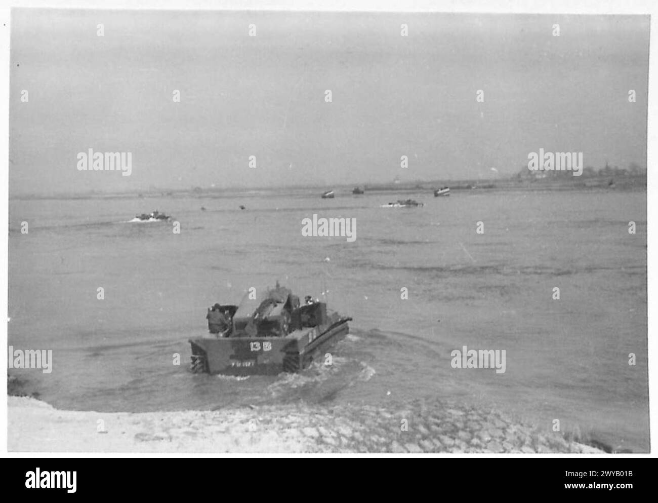 RHINE CROSSING - Original wartime caption: Buffaloes cross the Rhine ...