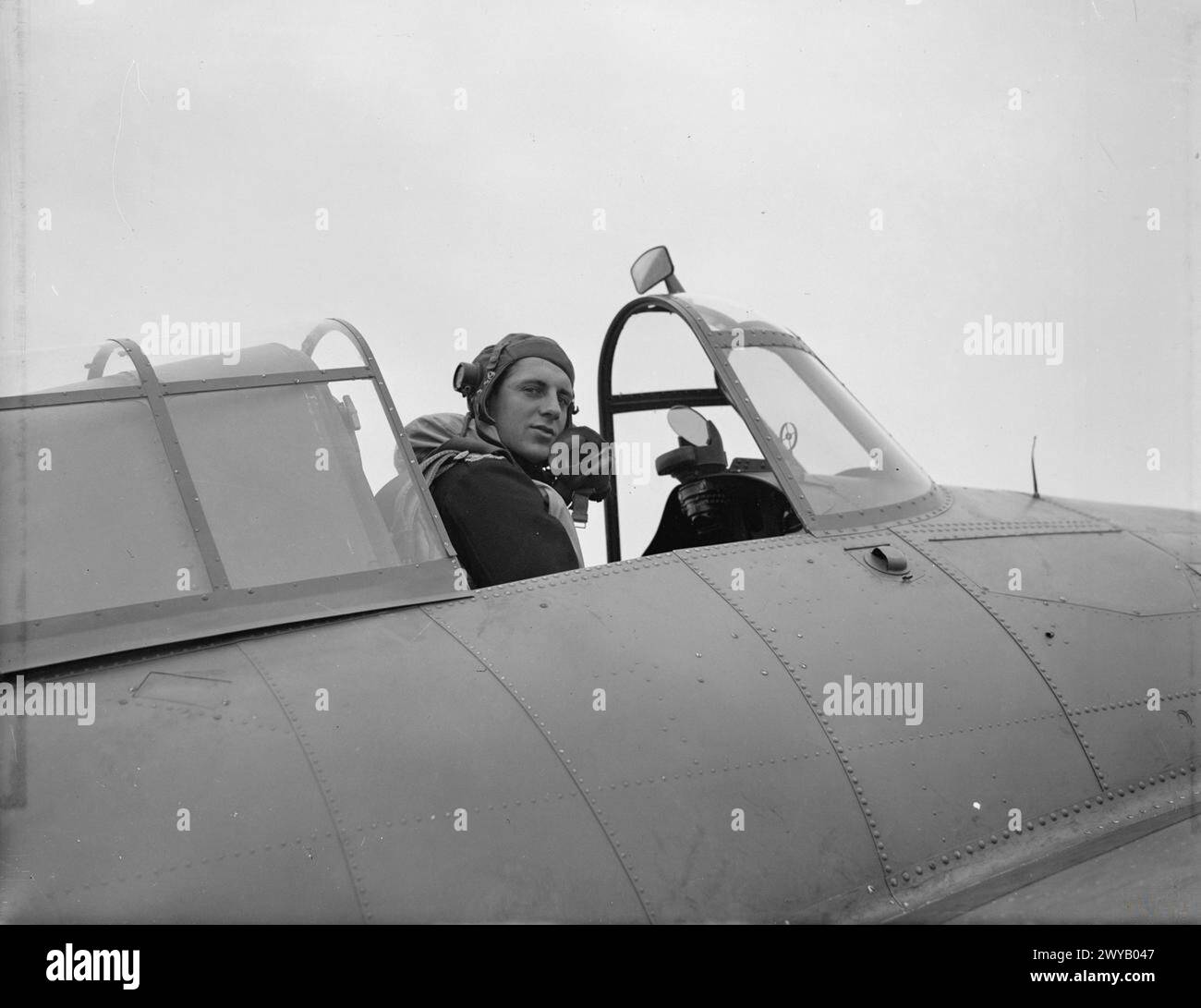 Fleet Air Arm pilot Sub-Lieutenant G. Warren RNVR is on board HMS ...